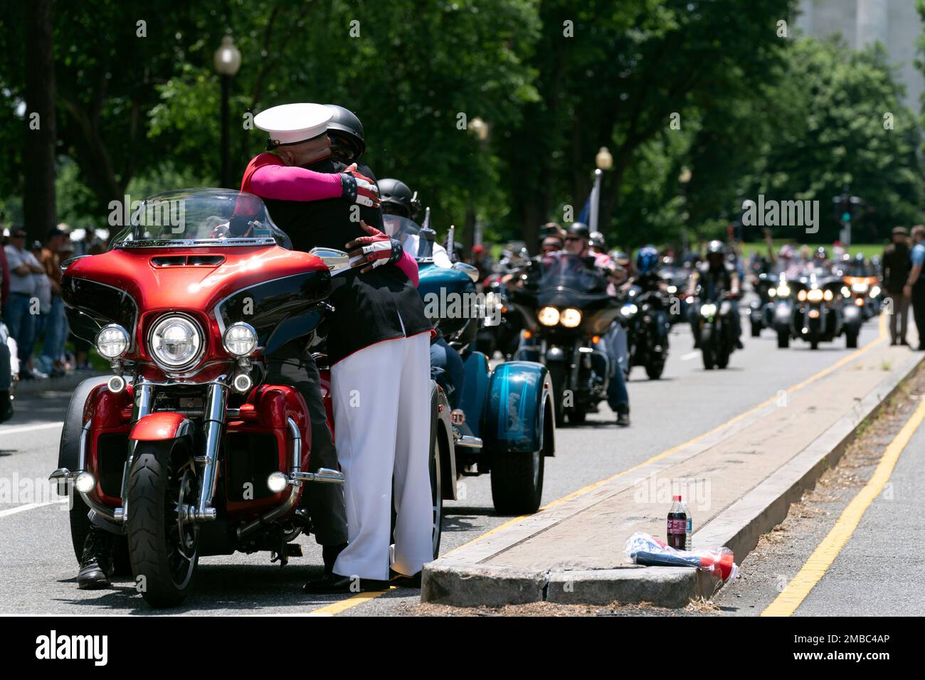 U.S. Marine Corps Staff Sgt. Tim Chambers gives a hug as participants ...
