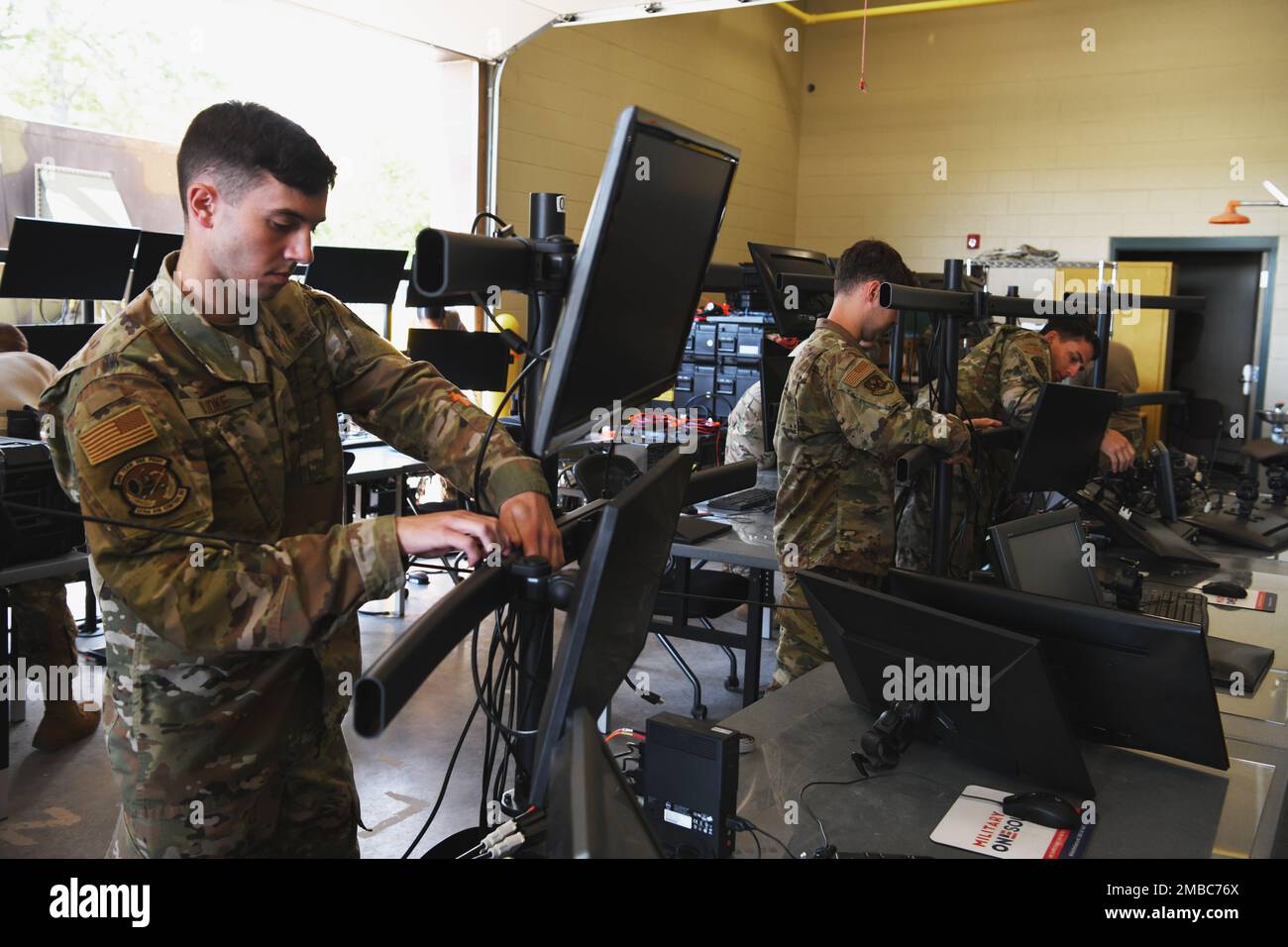 Airmen assigned to the 123rd Air Control Squadron disassemble computer ...
