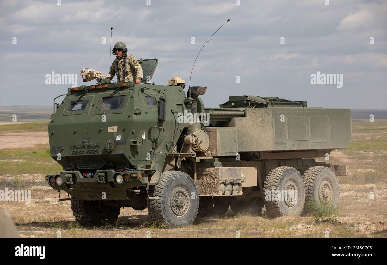 An M142 High Mobility Artillery Rocket System moves to a launching ...