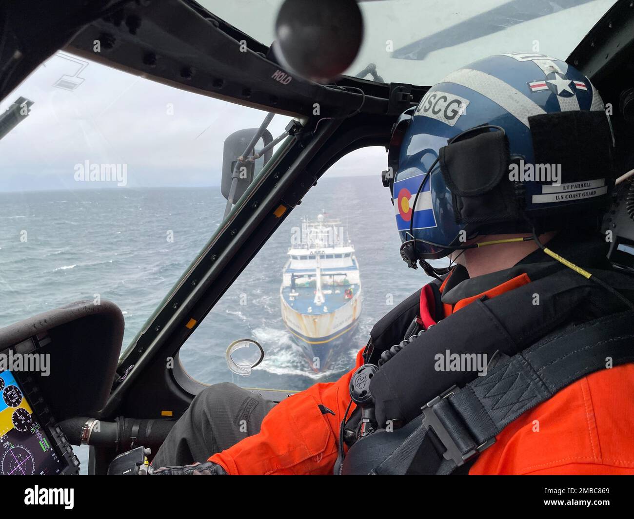 Coast Guard Lt. Zachary Farrell is shown flying an MH-60 Jayhawk ...