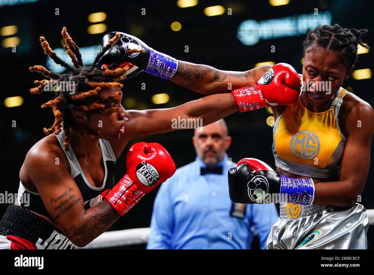 Haiti's Jaica Pavilus, left, throws a left at Mia Ellis during the ...