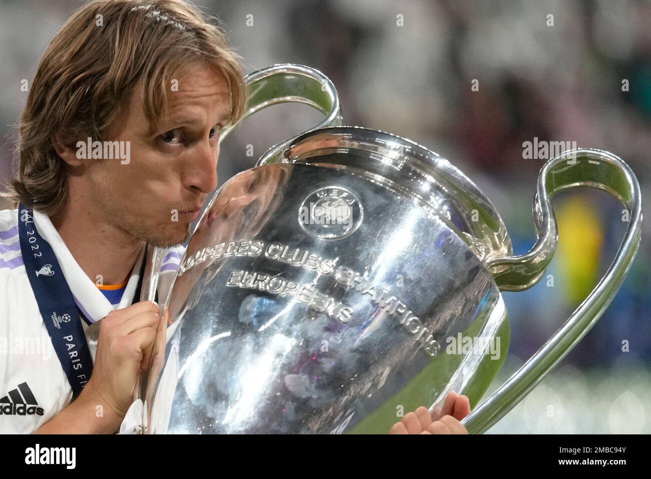 Real Madrid's Luka Modric kisses the trophy after winning the Champions ...