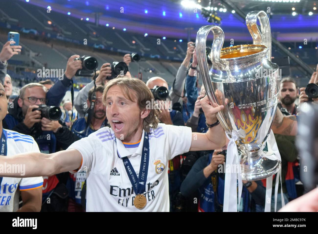 Real Madrid's Luka Modric holds the trophy after winning the Champions ...