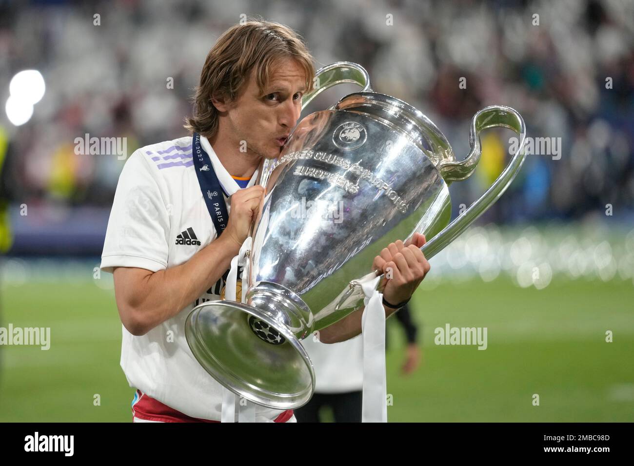Real Madrid's Luka Modric kisses the trophy after winning the Champions ...