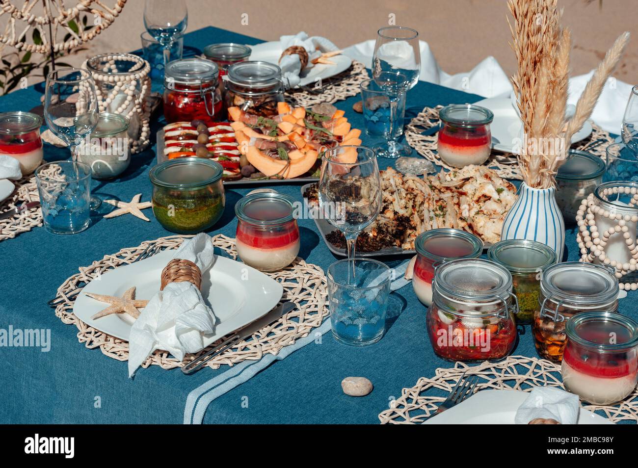 Beautiful table setting with plate, white napkin, braided decorative ...