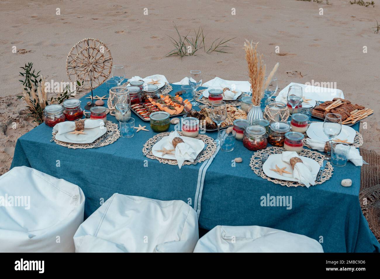 Delicious food and flowers for outdoor summer picnic. Lunch on the ...