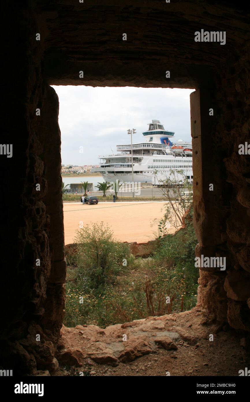 a cruise ship seen from inside a ruin Stock Photo - Alamy