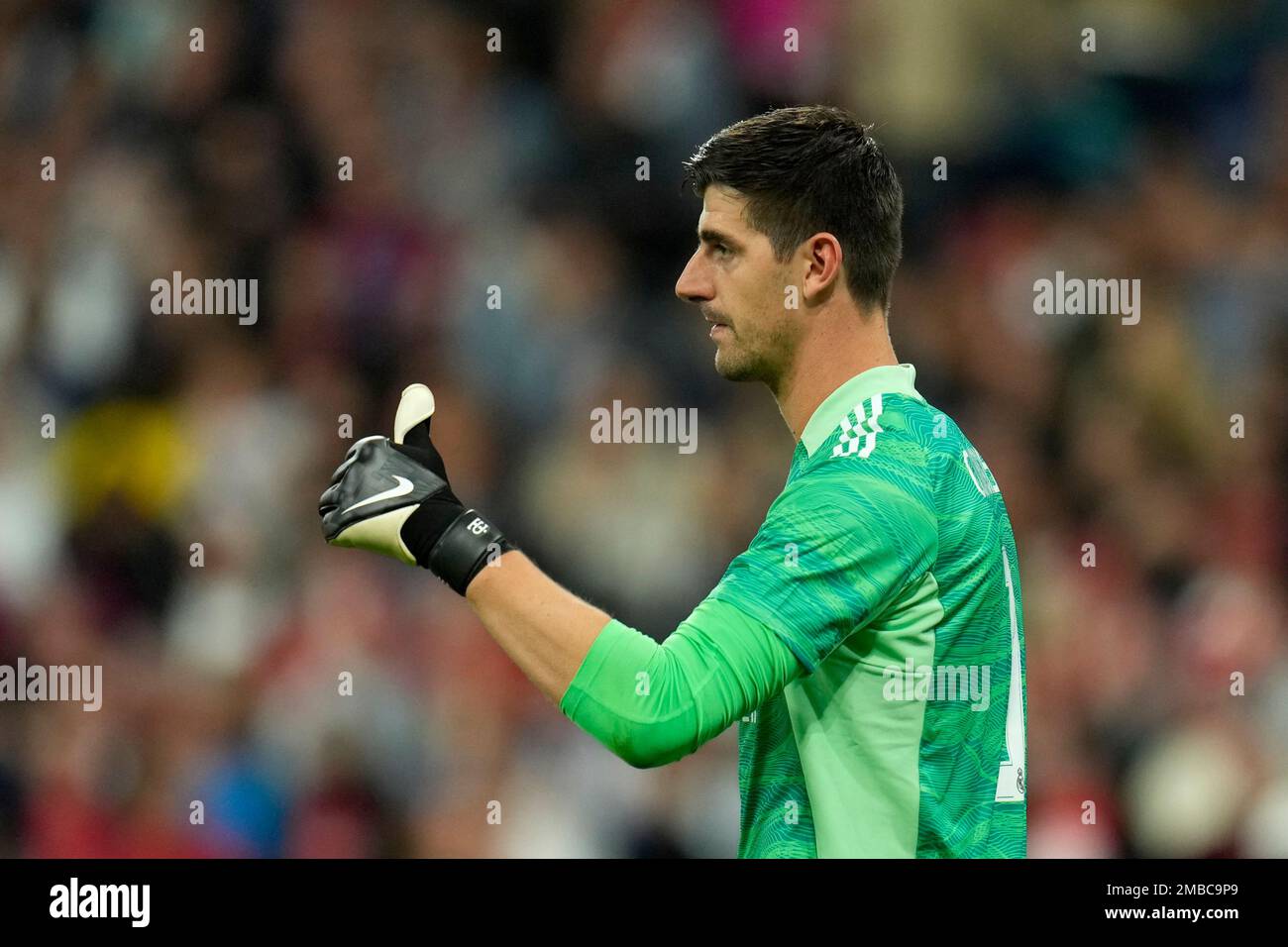 Real Madrid's goalkeeper Thibaut Courtois gestures during the Champions ...