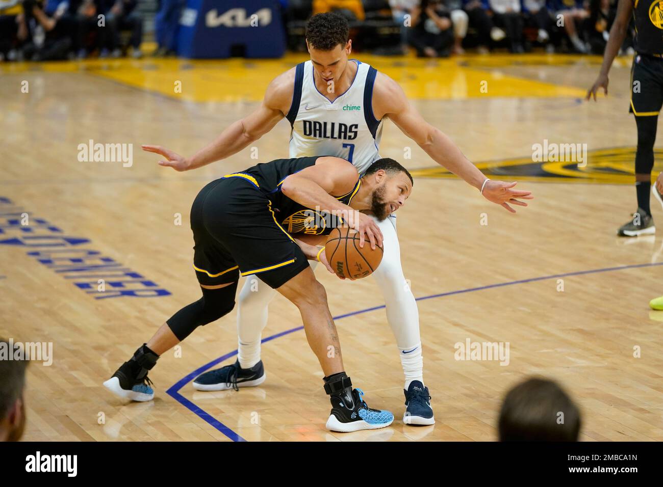 Golden State Warriors guard Stephen Curry, bottom, is defended by ...