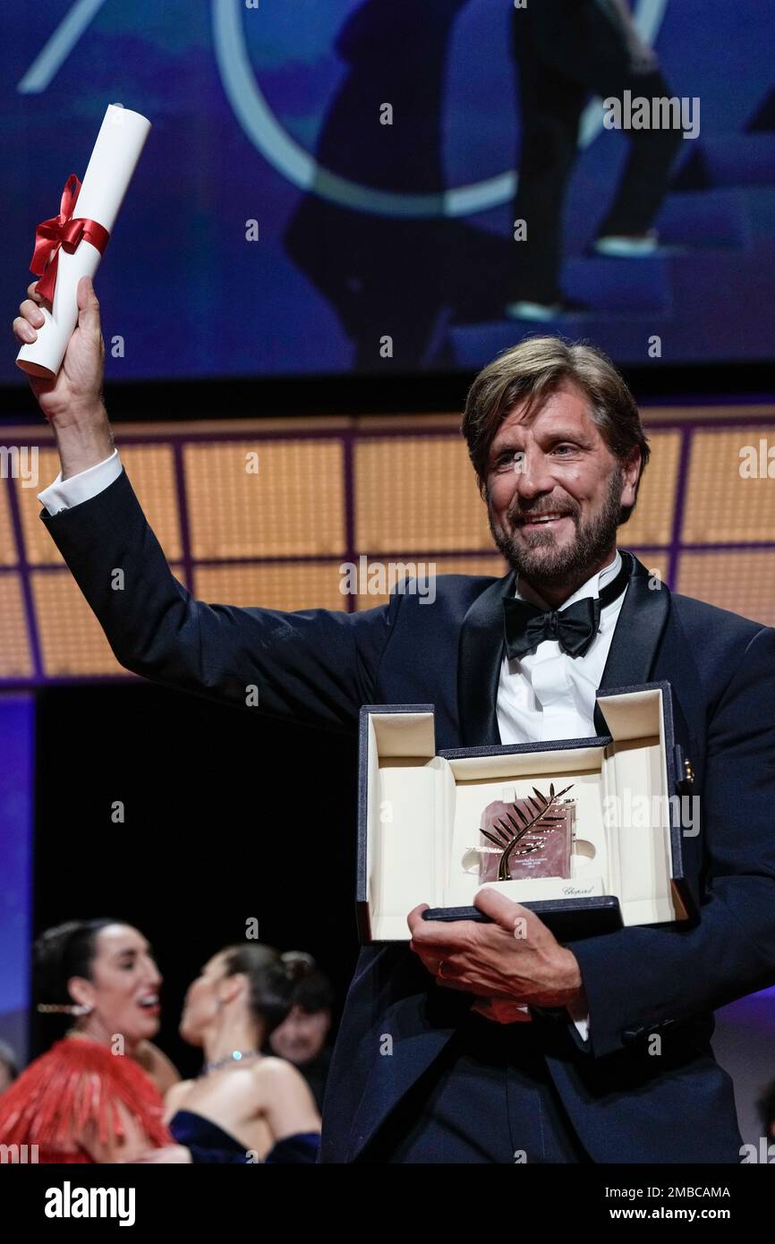 Writer/director Ruben Ostlund accepts the Palme d'Or for 'Triangle of Sadness' during the awards ...