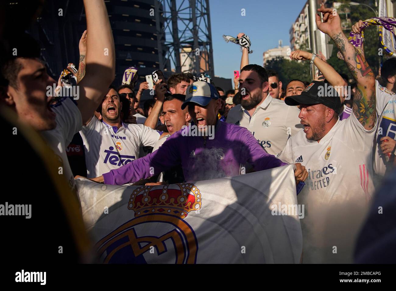 Real Madrid supporters react before entering to watch the Champions ...