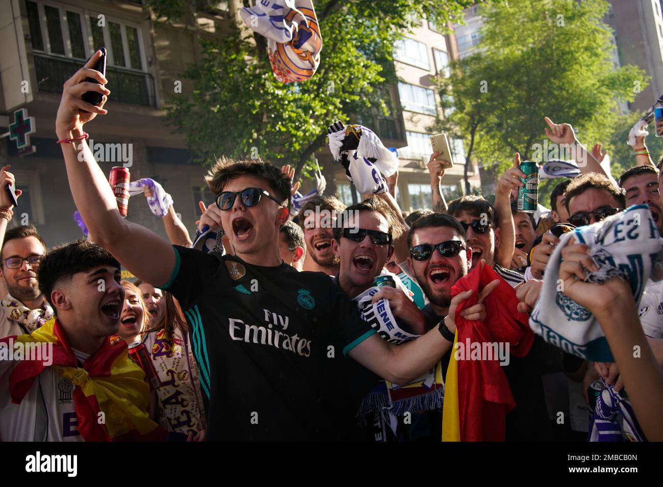 A Real Madrid supporter takes a selfie with other fans before entering ...
