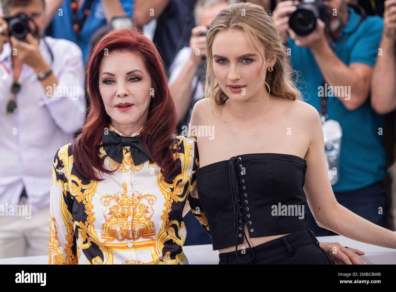 Priscilla Presley, left, and Olivia DeJonge pose for photographers at ...