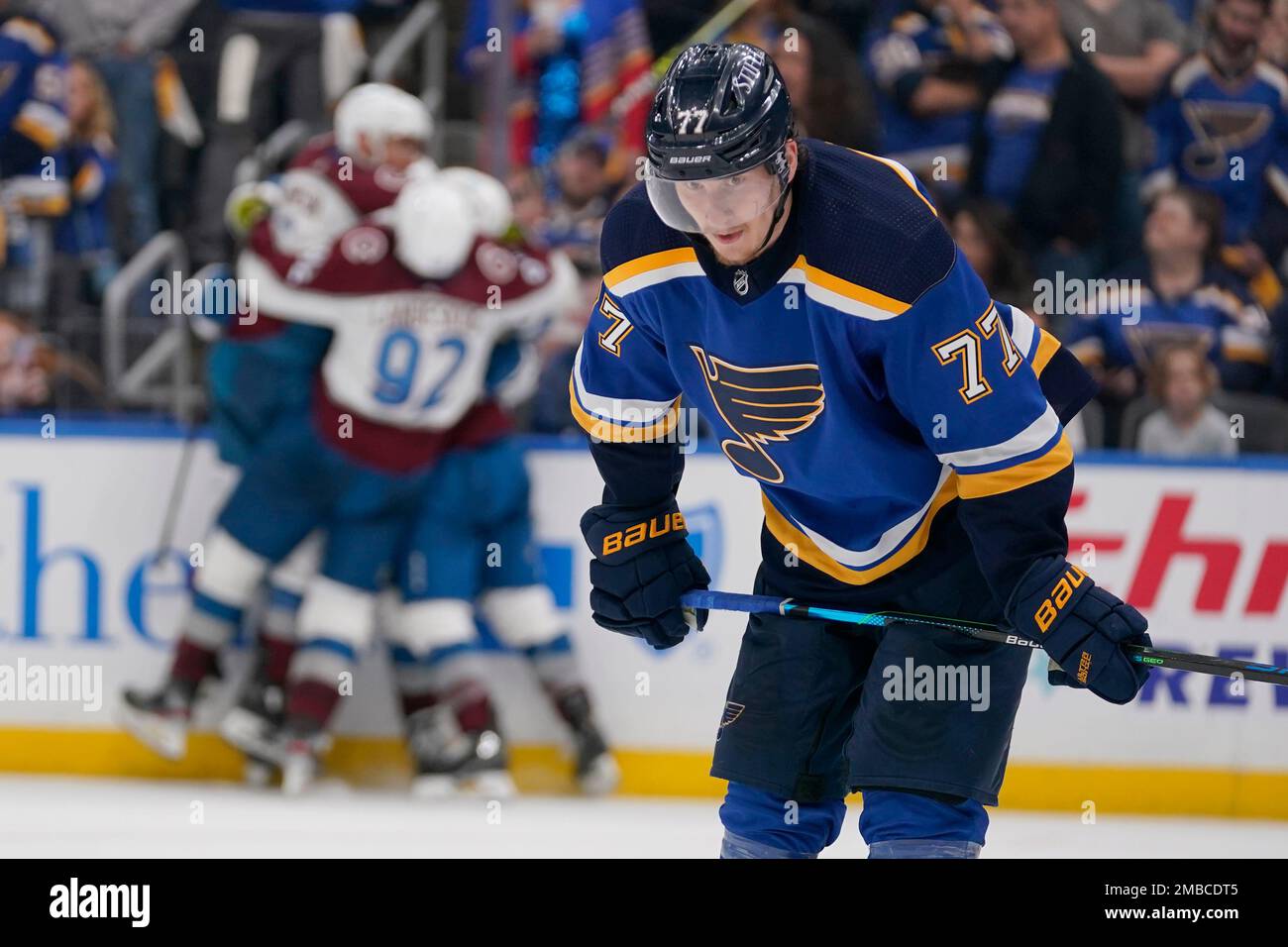 St. Louis Blues' Niko Mikkola, right, reacts as teammates congratulate ...