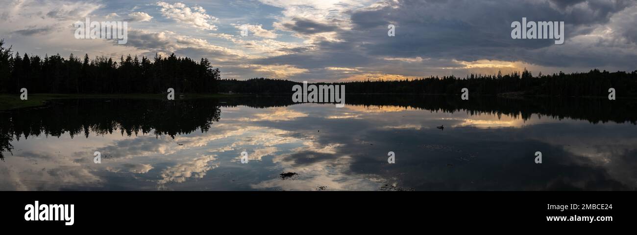 Twilight over a still cove in Downeast Maine Stock Photo - Alamy