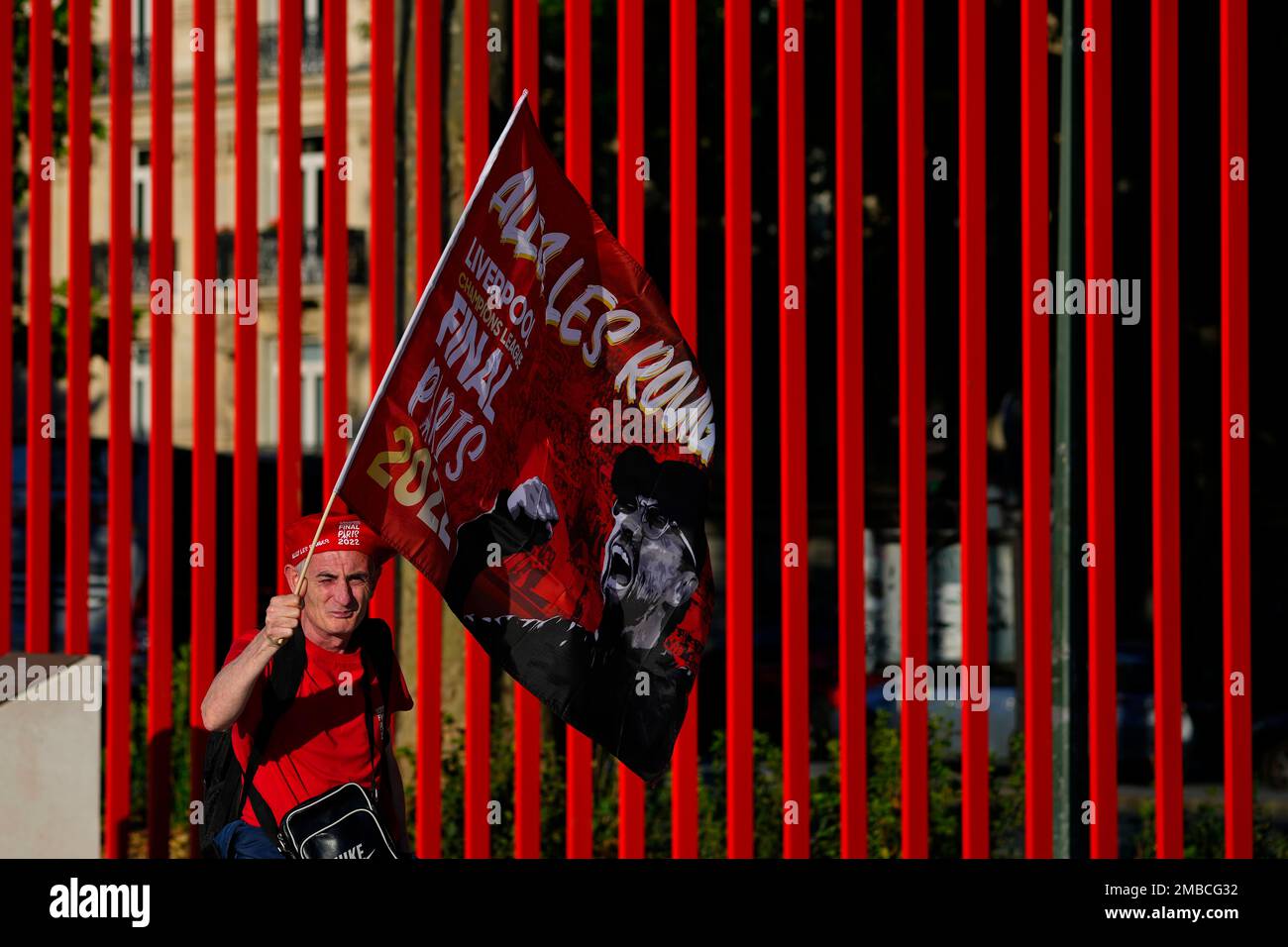 A Liverpool fan holds a flag in Paris, Friday, May 27, 2022. Liverpool ...