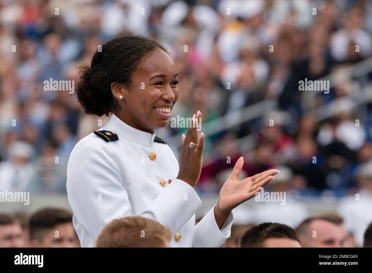 Midshipman Sarah Skinner, who is a Rhodes Scholar, reacts as President ...