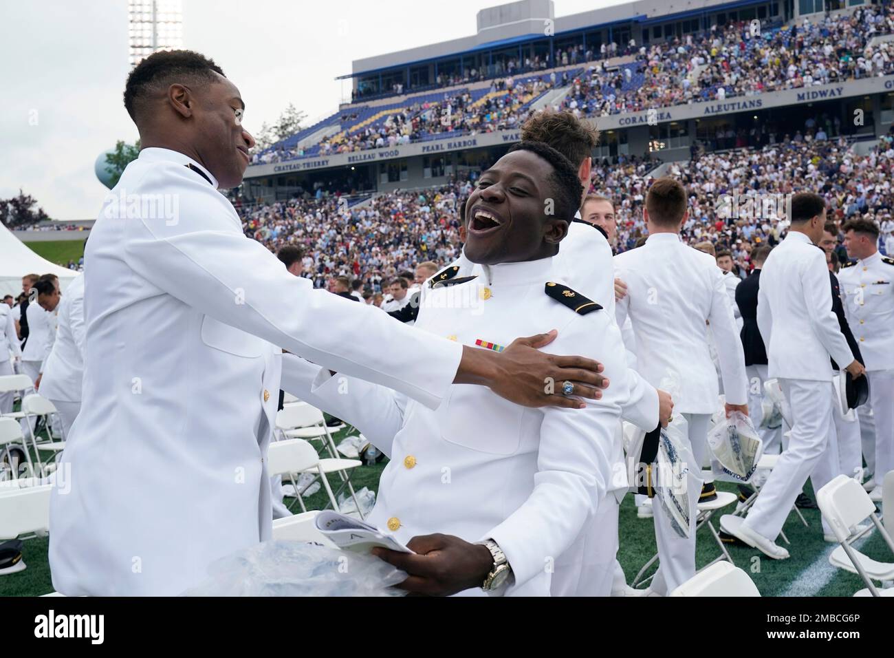 Graduating midshipman celebrate during the U.S. Naval Academy's ...