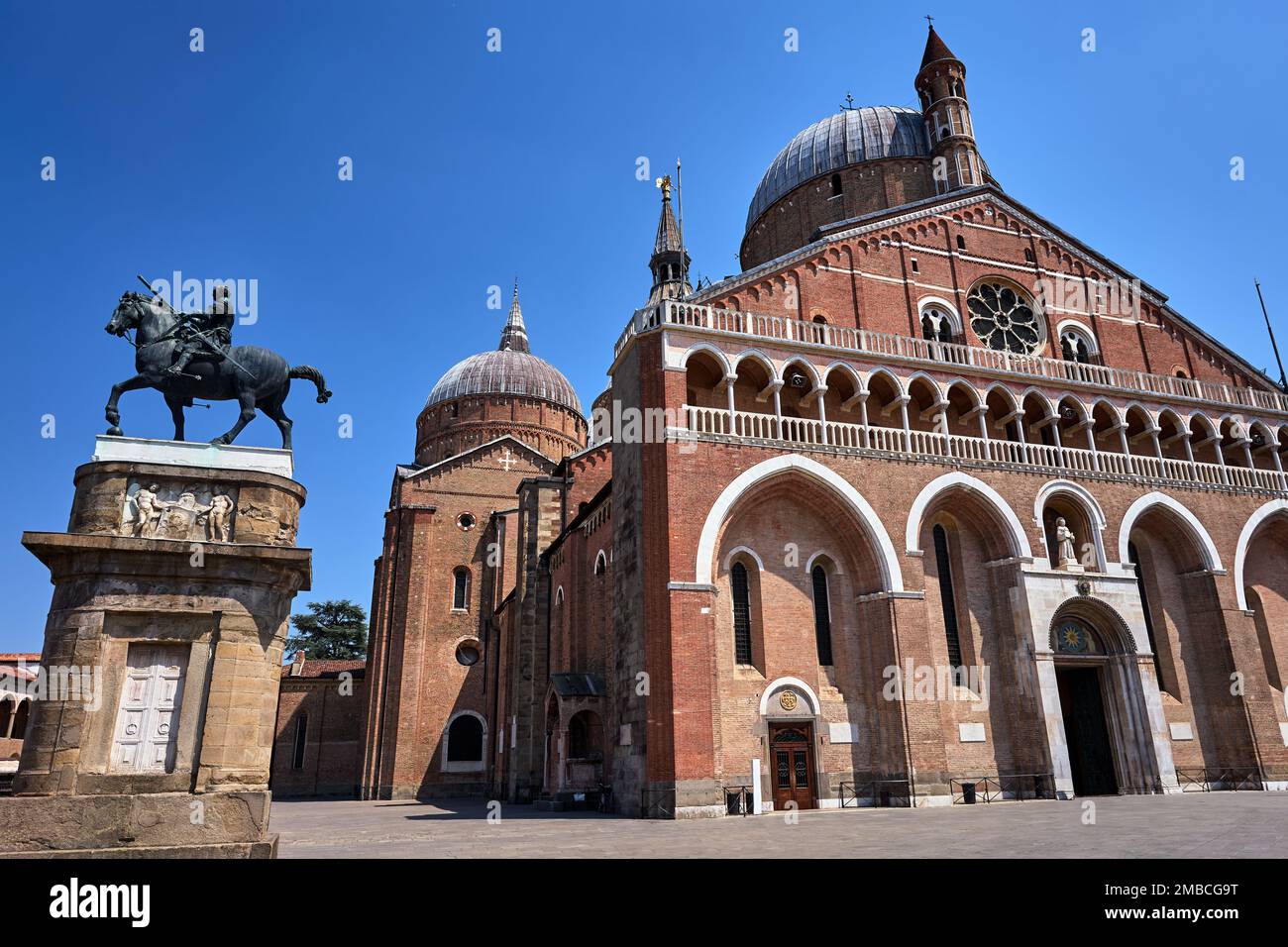 Statue of a mounted knight and the facade of the medieval church of St ...