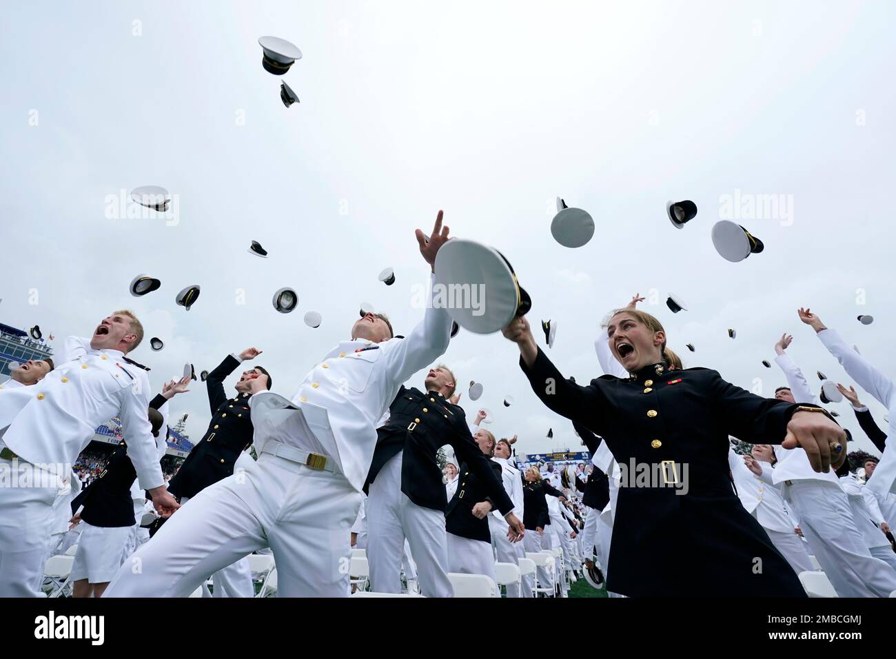 Graduating midshipman toss their covers during the U.S. Naval Academy's ...