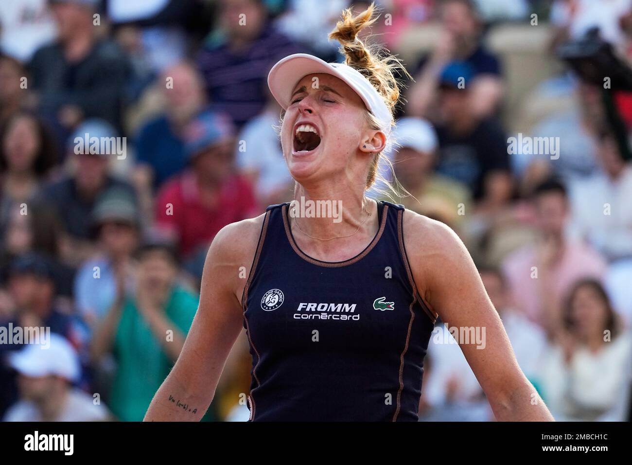 Switzerland's Jil Teichmann screams after reaching 5-5 in the third set ...
