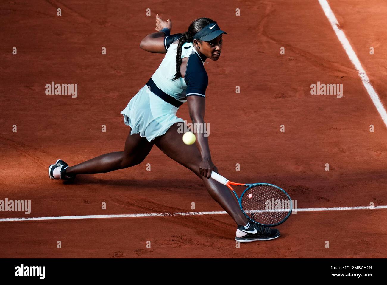 Sloane Stephens of the U.S. returns the ball to France's Diane Parry ...