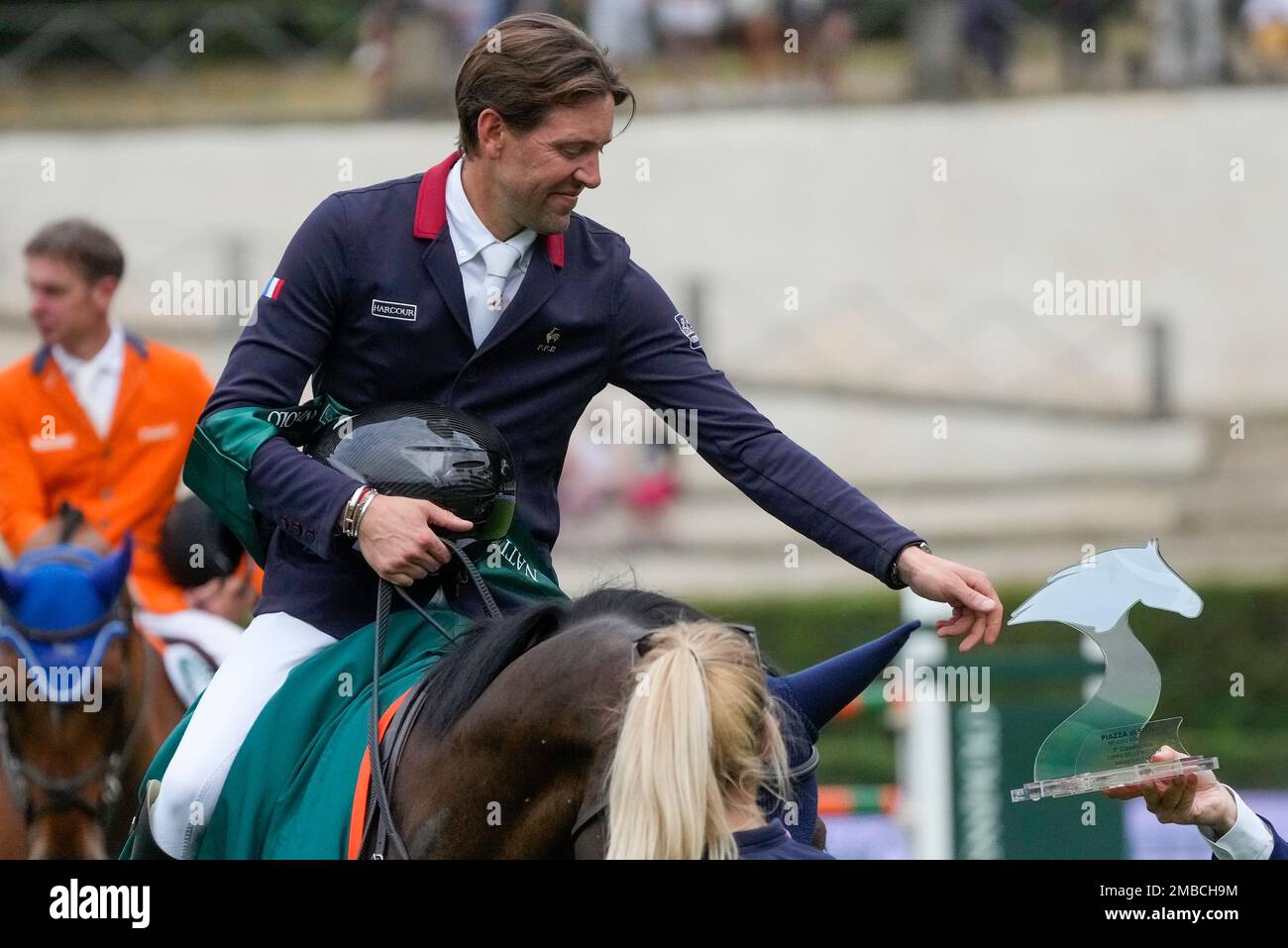 France's Kevin Staut on Visconti du Telman receives the trophy after ...