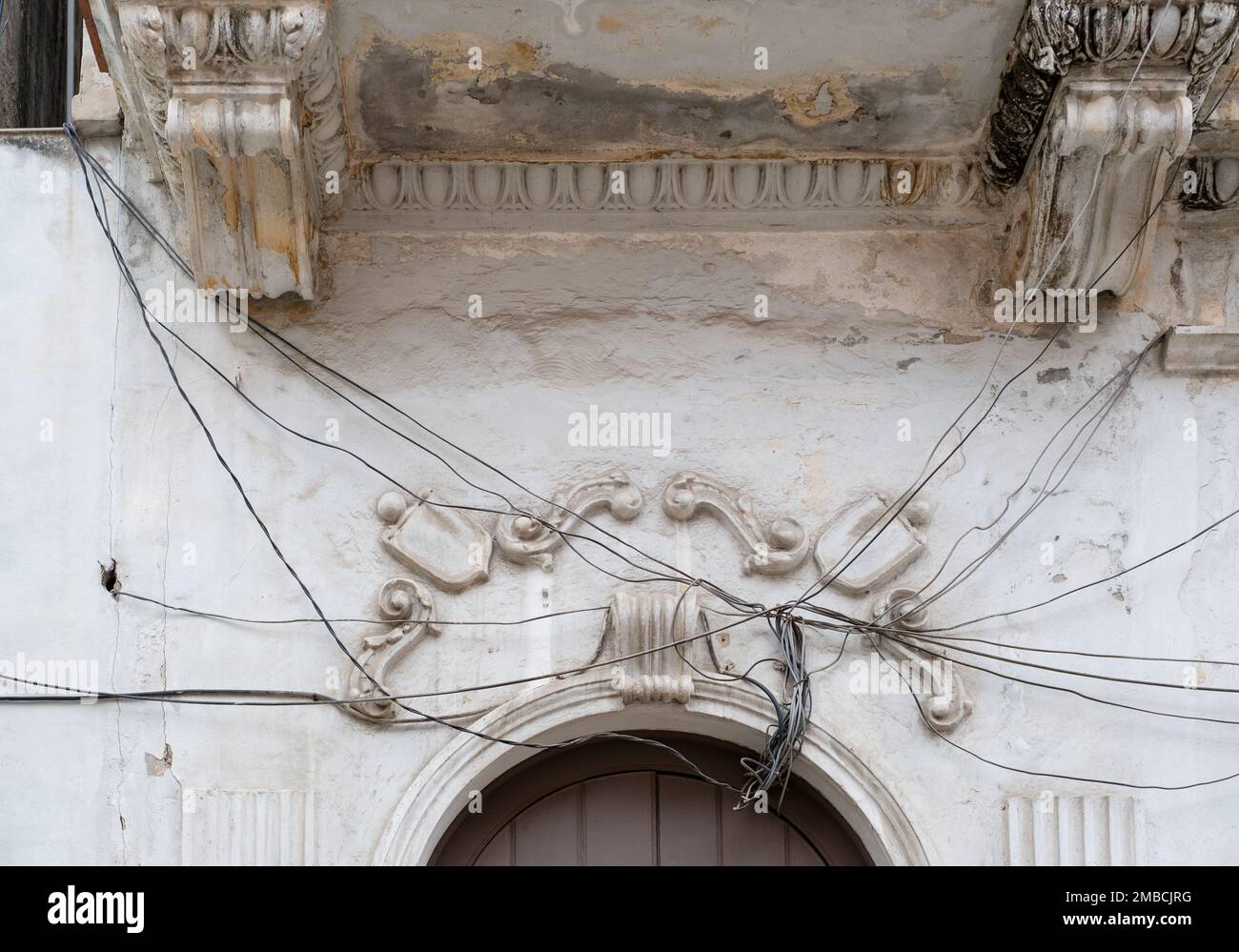 Detail of cables/wires emerging from a doorway in Habana Vieja, Havana ...