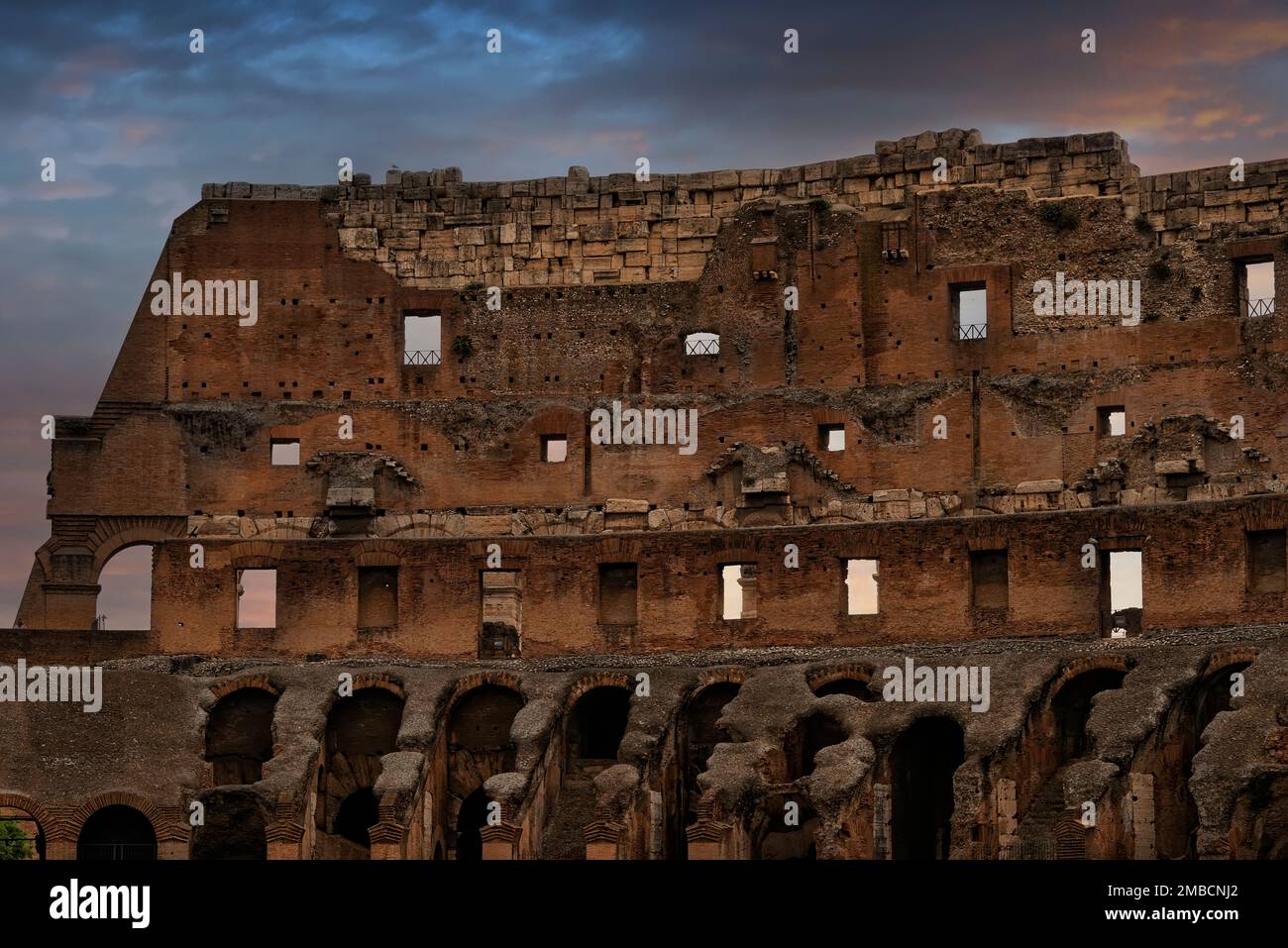 Sunset over the historical landmark of the Colosseum in Rome, Italy ...