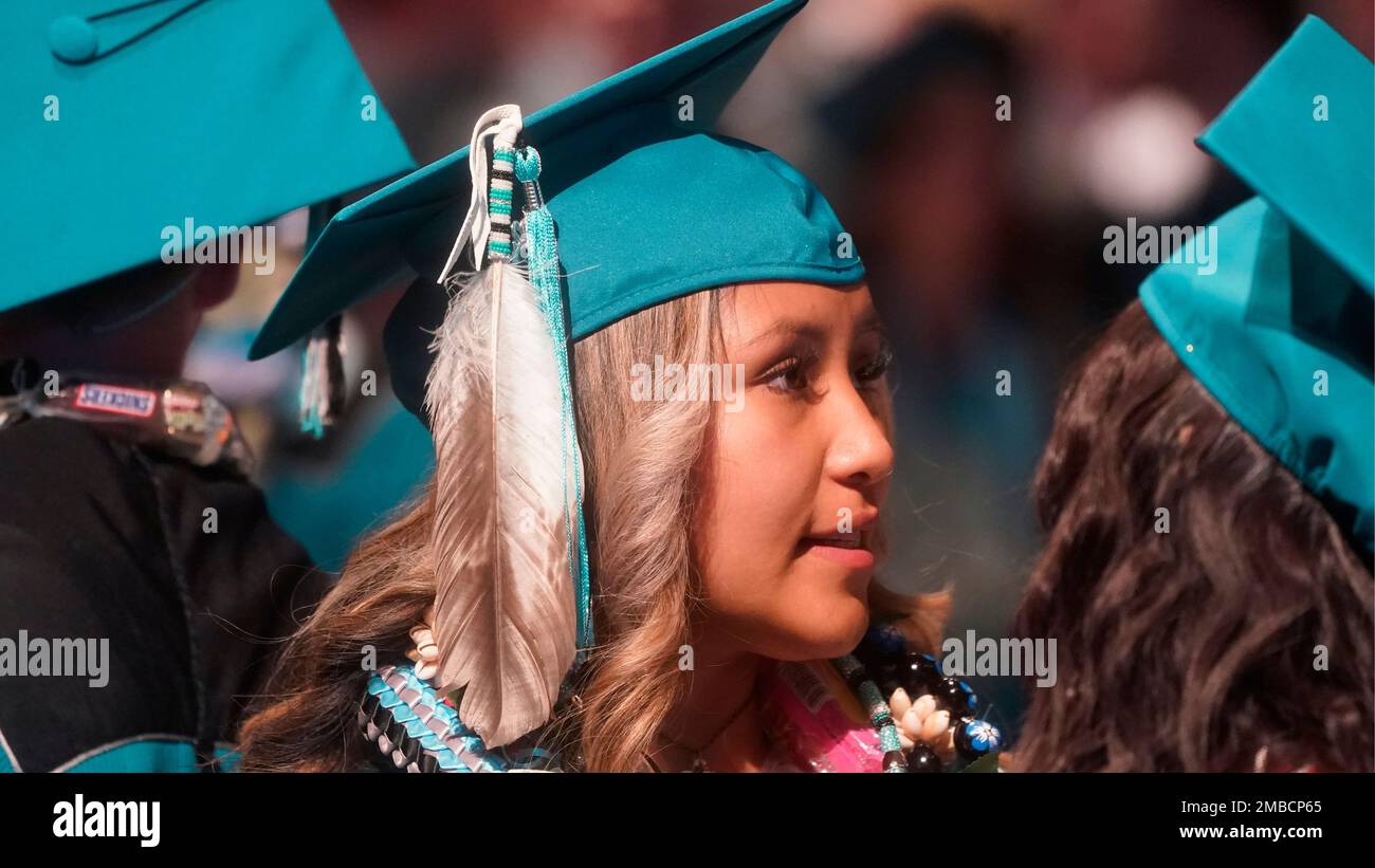 Brailyn Jake wears an eagle feather at her graduation from Cedar City ...
