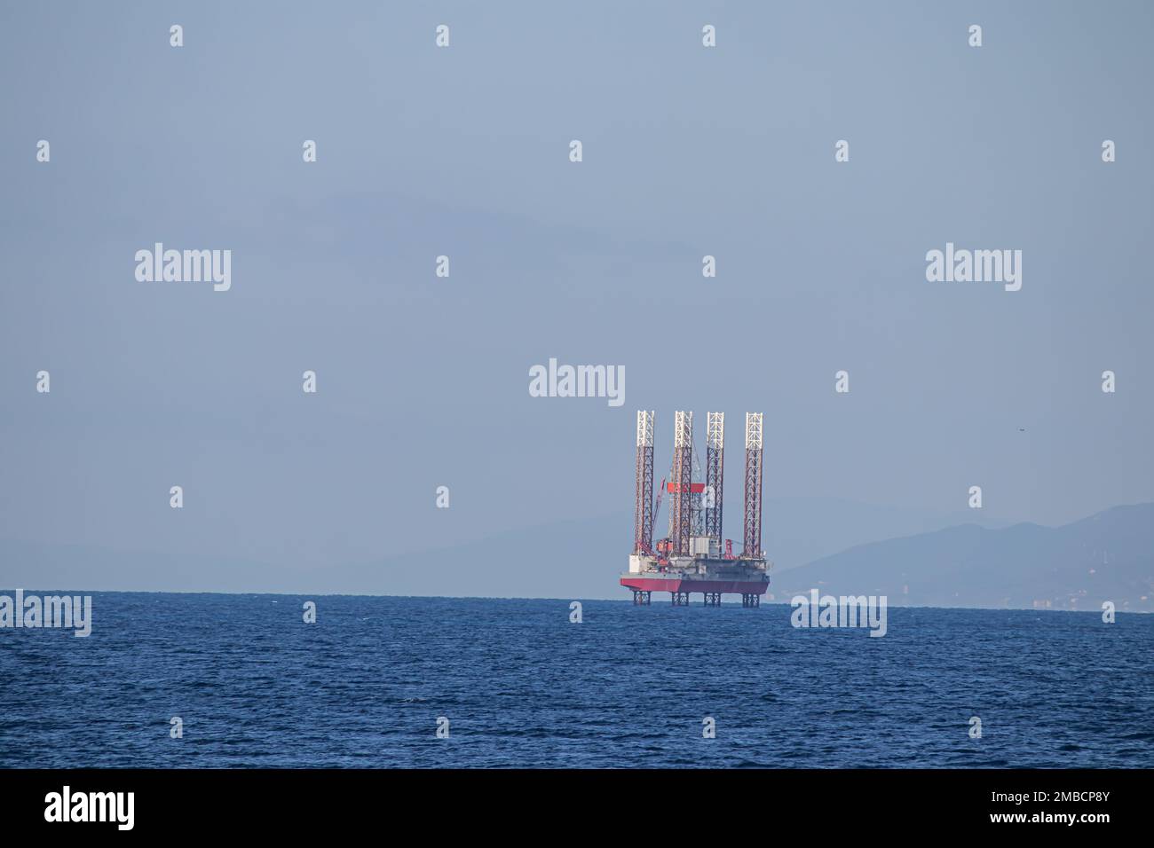 Oil refinery platform at the open sea, producing black gold Stock Photo ...