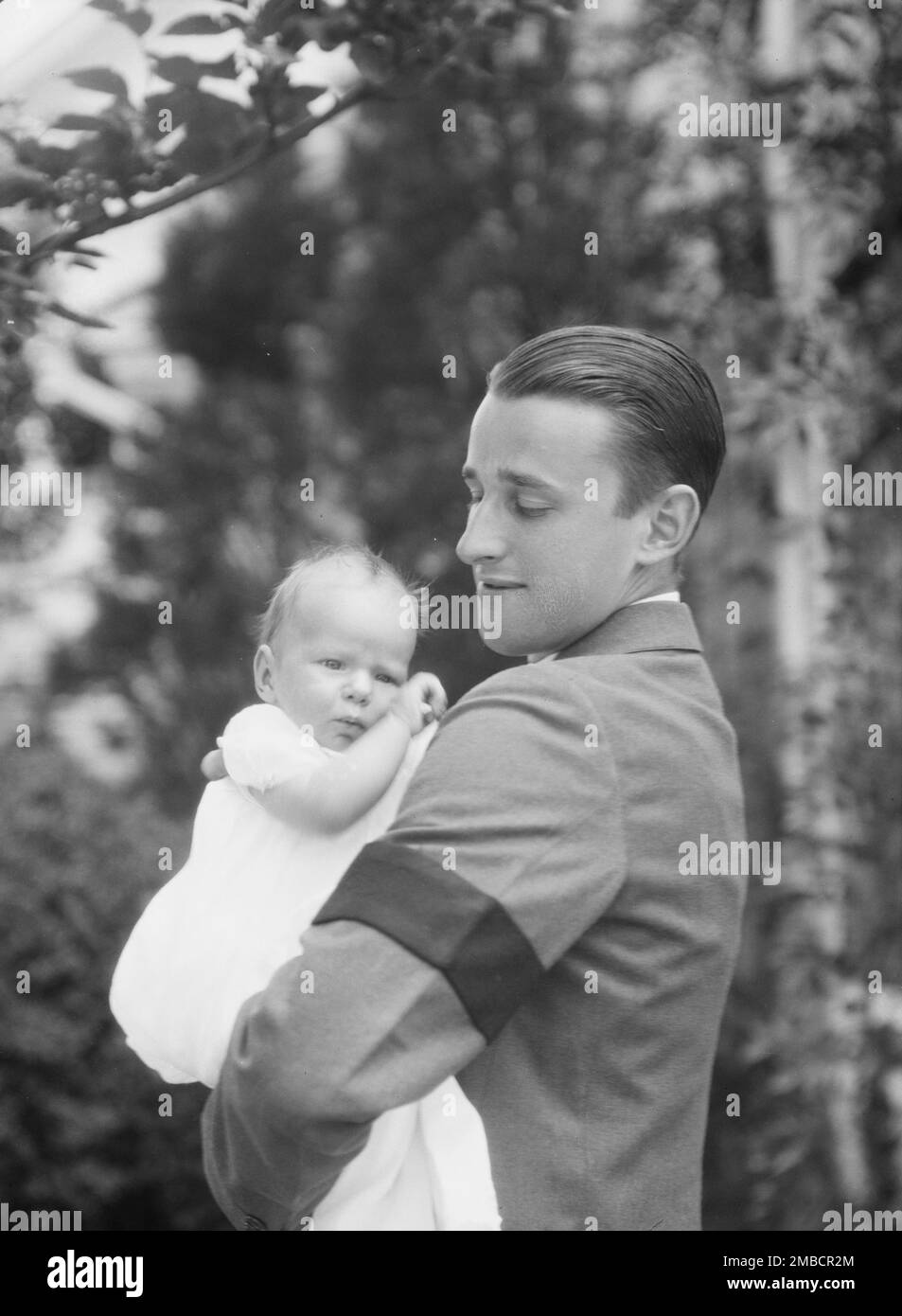 Brady, James Cox, Jr., Mr., and child, outdoors, 1930 May 24 Stock ...