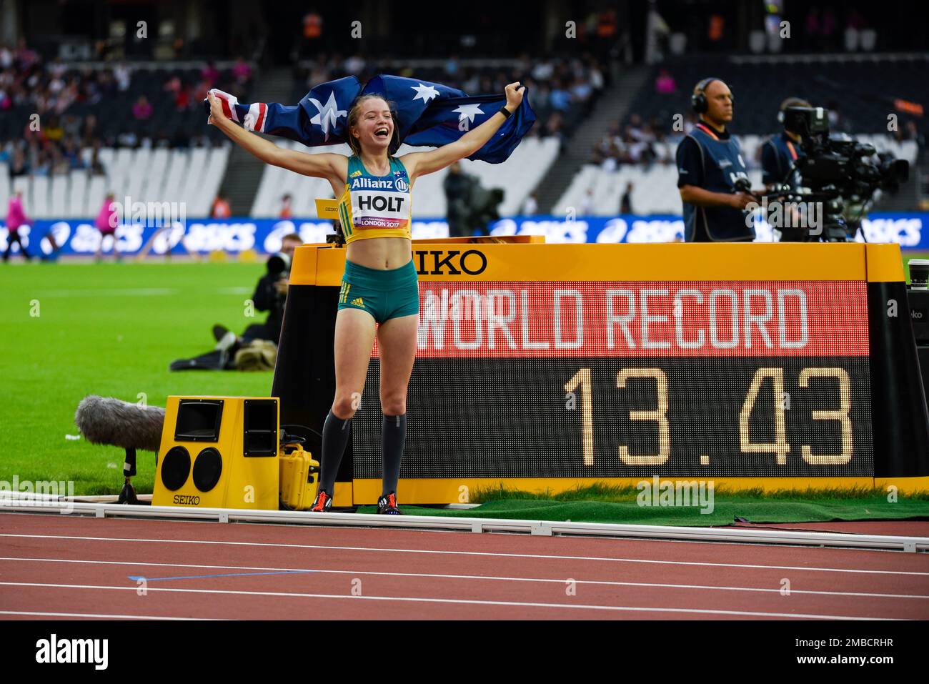 Isis Holt celebrating after winning the 100m T35 in record time in the ...
