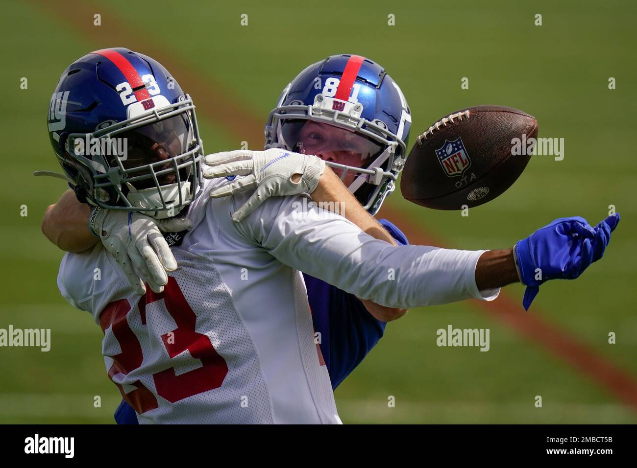 New York Giants' Michael Jacquet III, left, and Alex Bachman ...