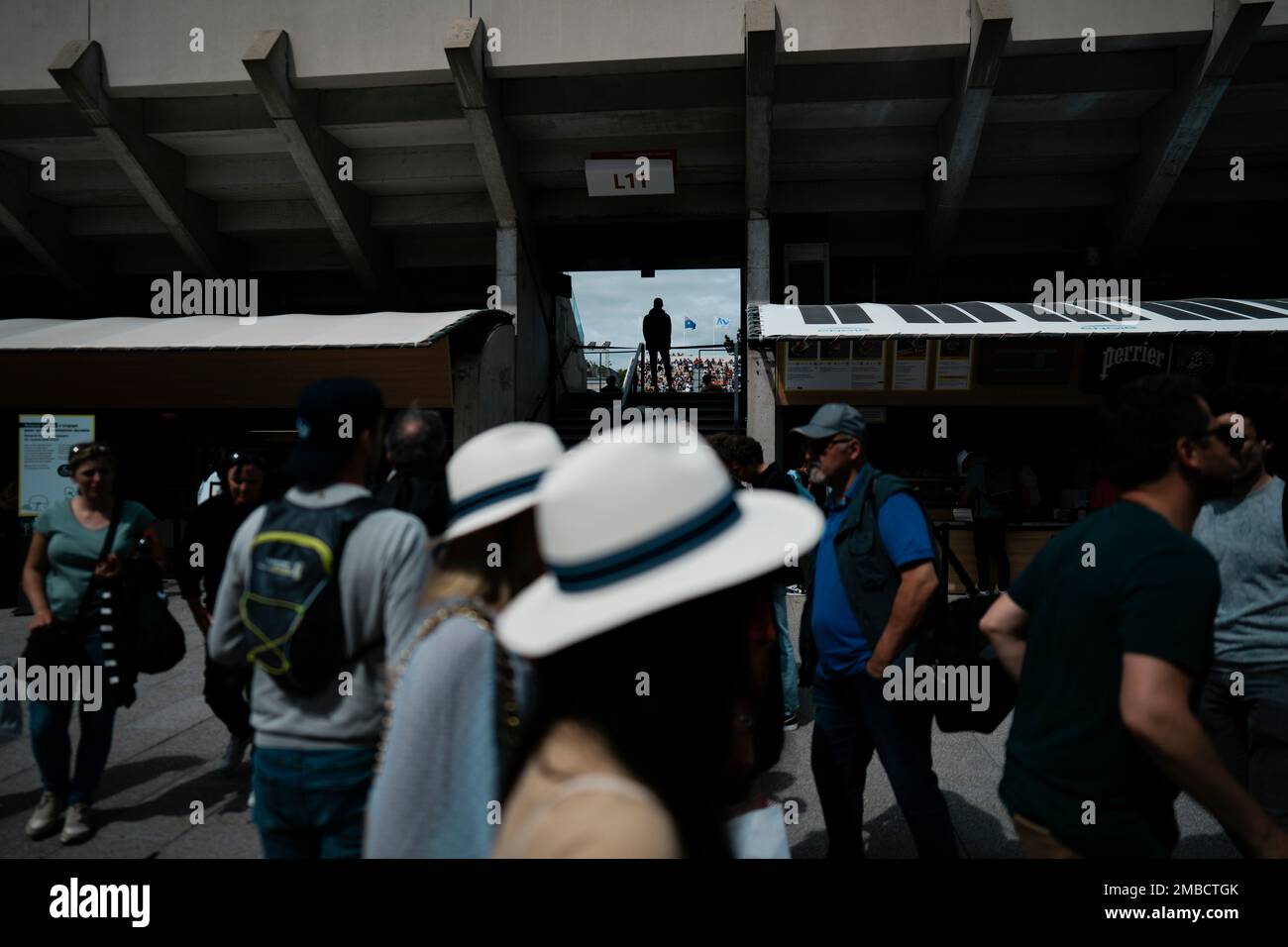 Spectators stroll during second round matches at the French Open tennis ...