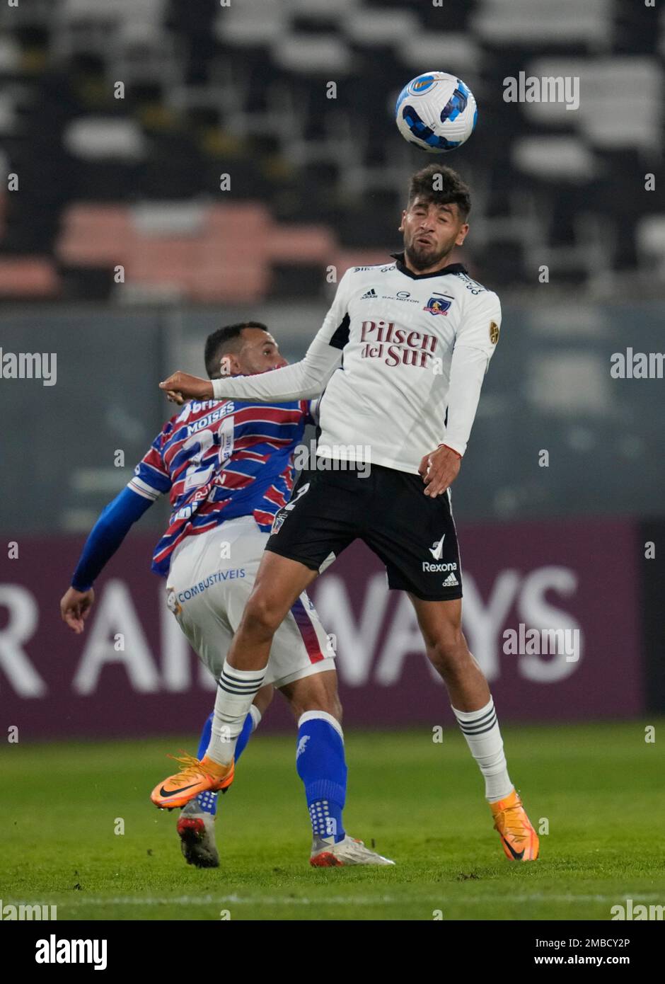 Jeyson Rojas of Chile's Colo Colo, front, heads a ball aginst Moises of ...