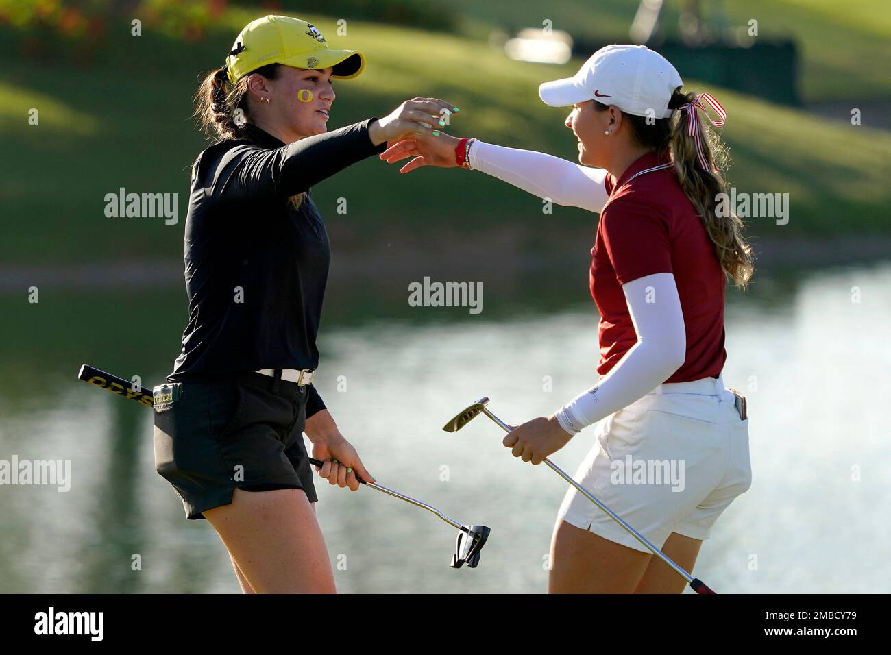 Oregon golfer Briana Chacon, left, hugs Stanford golfer Sadie Englemann ...