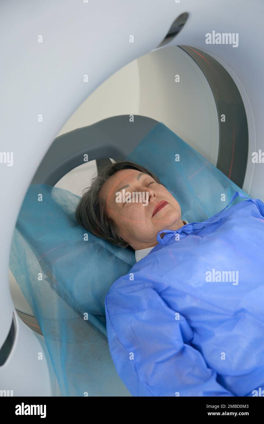 Elderly woman is placed in the camera of MRI machine Stock Photo - Alamy