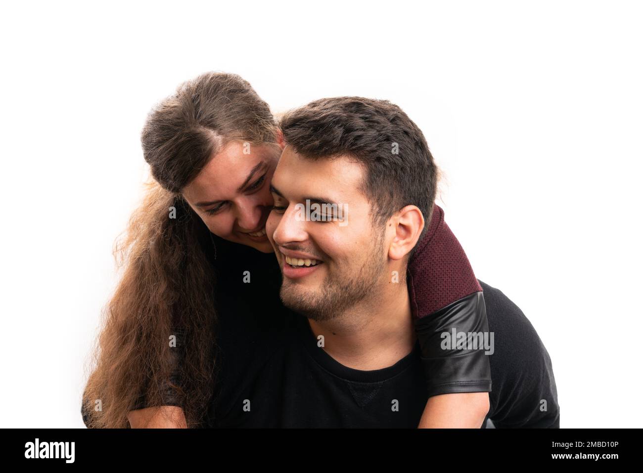 Young cute male and female couple hugging with cheerful expression as ...