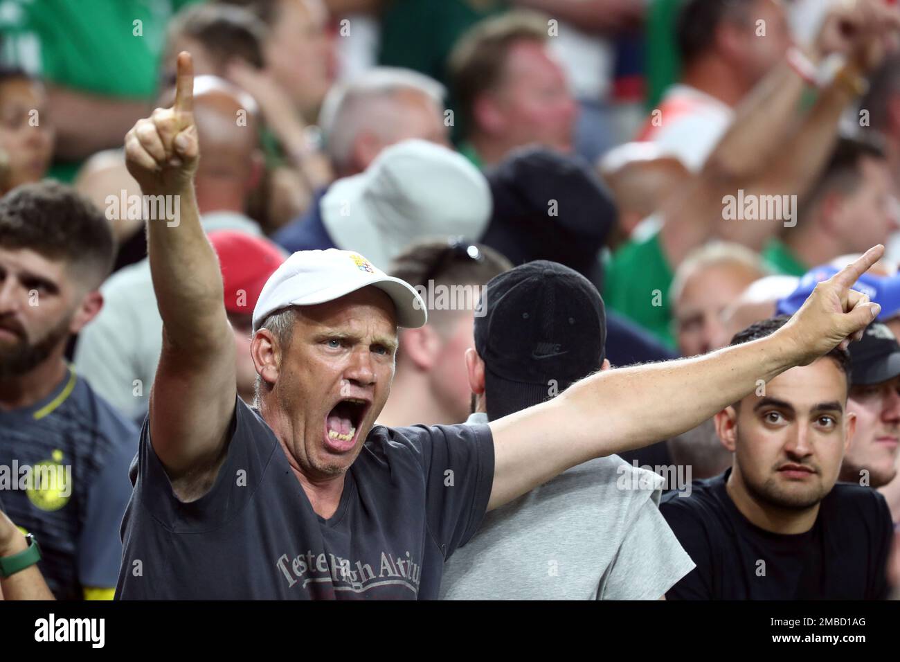 A Feyenoord fan cheers before the Europa Conference League final ...