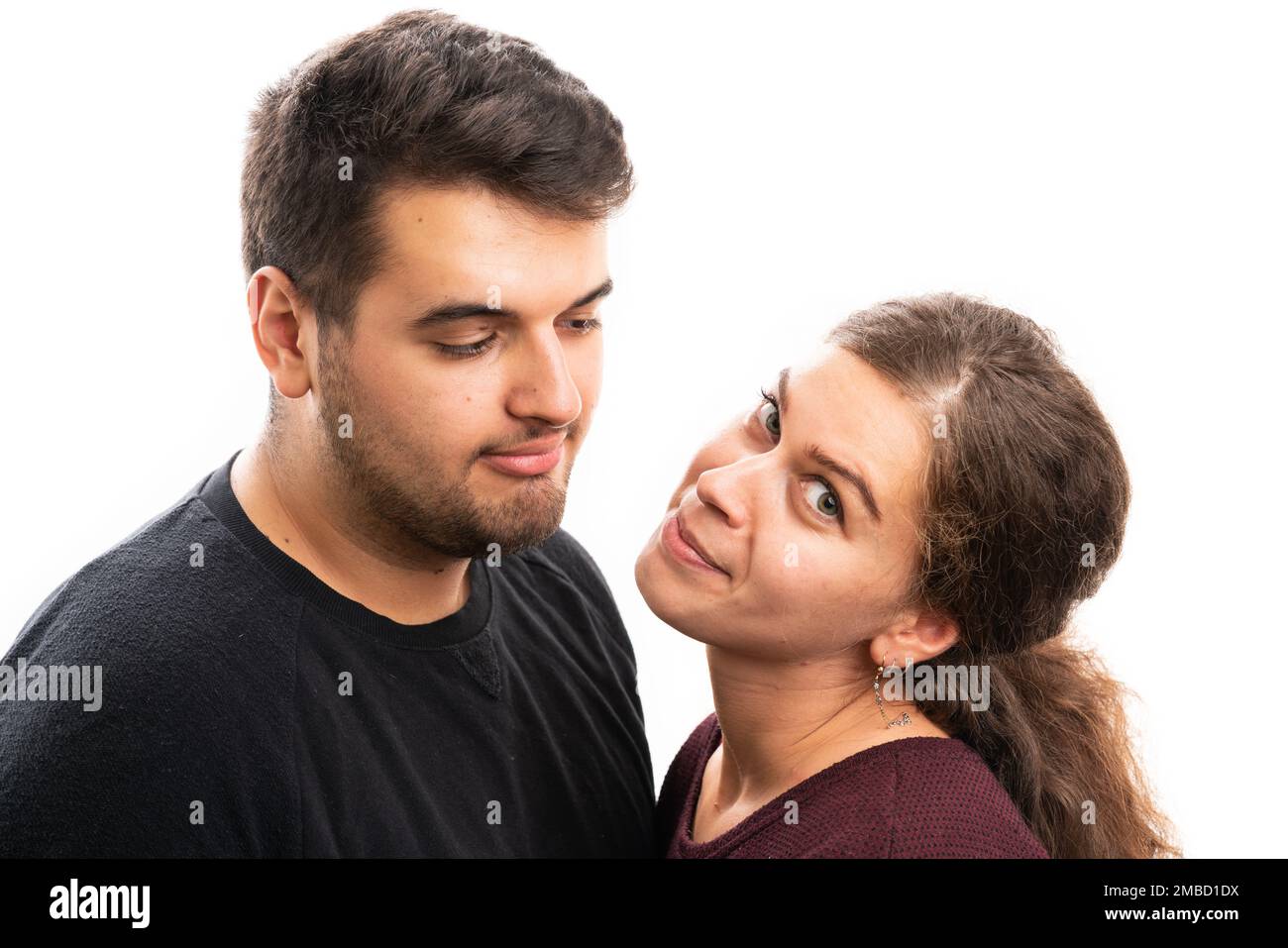 Adult male boyfriend looking at cute female model as girlfriend wearing ...