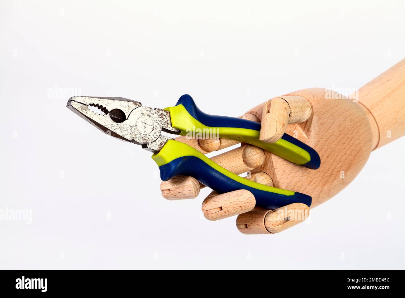 Wooden hand holding pliers hand tool isolated on a white background ...