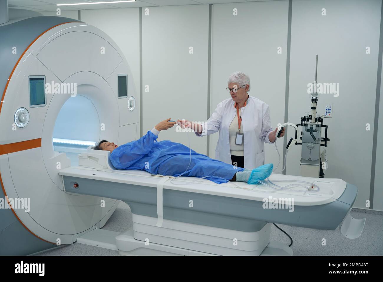 Two elderly ladies, doctor and patient are in MRI room Stock Photo - Alamy