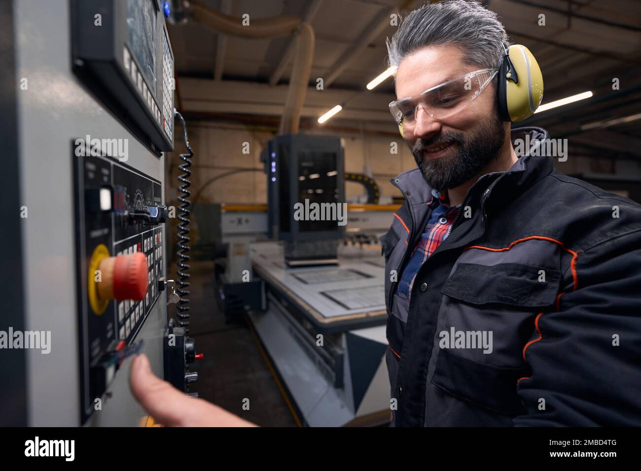 Worker working in workshop near the apparatus Stock Photo - Alamy