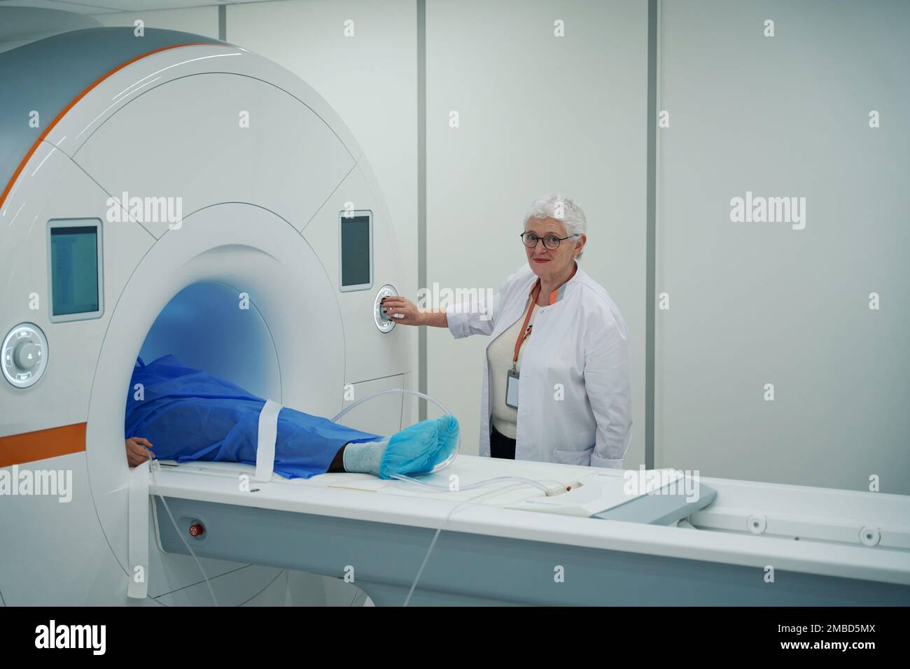Examination of a person on MRI machine in diagnostic department Stock ...