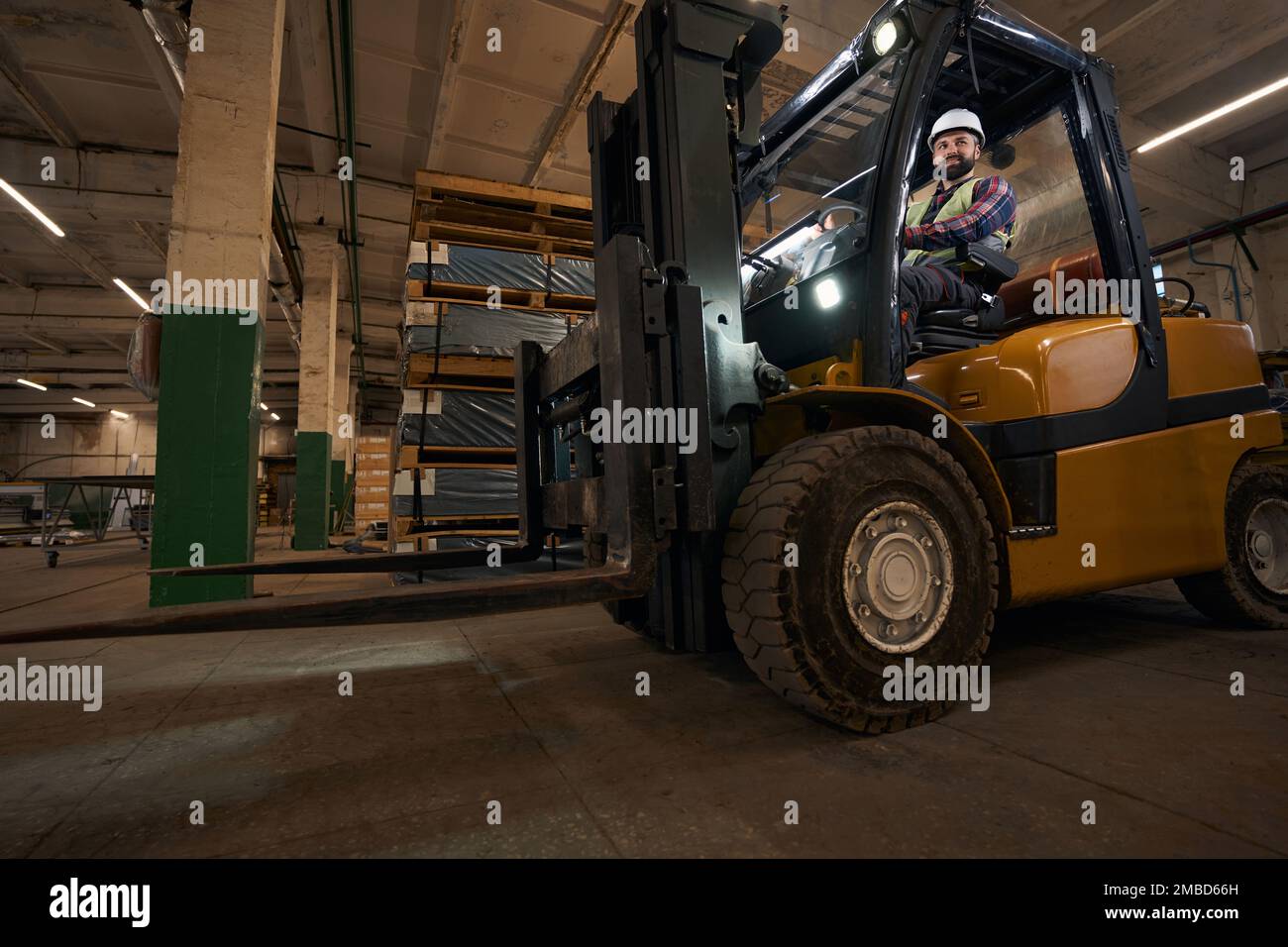 Loader sitting in car and preparing to load materials Stock Photo - Alamy