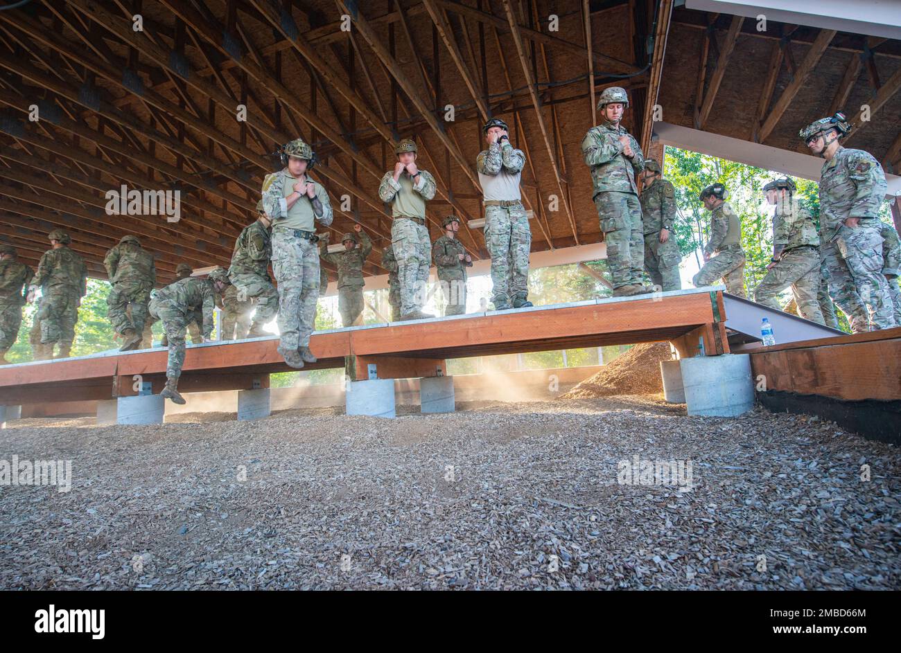 U.S. Army Soldiers and U.S. Air Force Airmen practice parachute landing ...