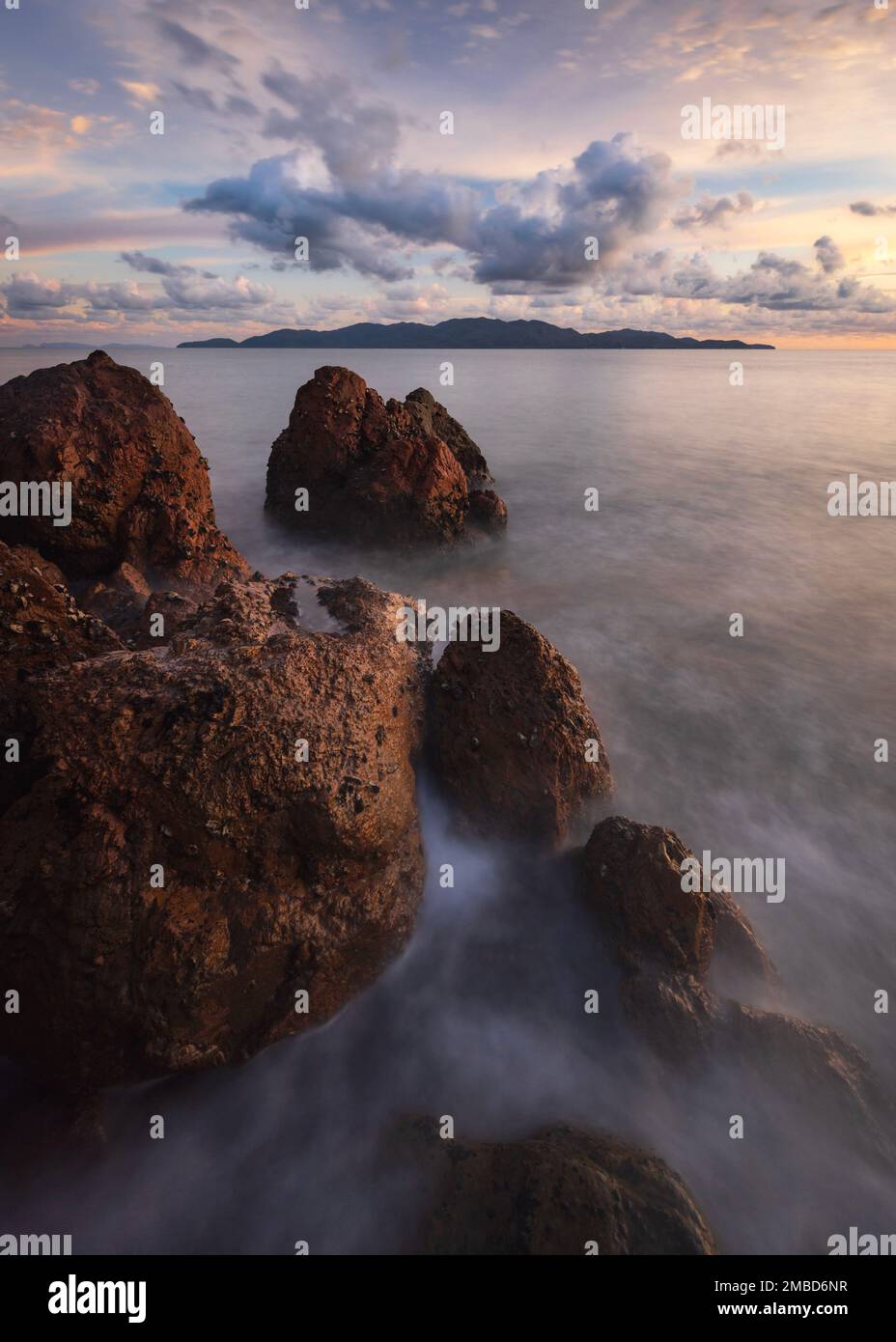 A vertical shot of the rocky coast Townsville, north-eastern coast of ...