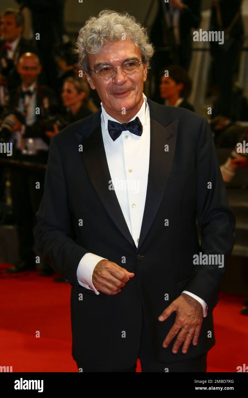 Director Mario Martone poses for photographers upon arrival at the ...