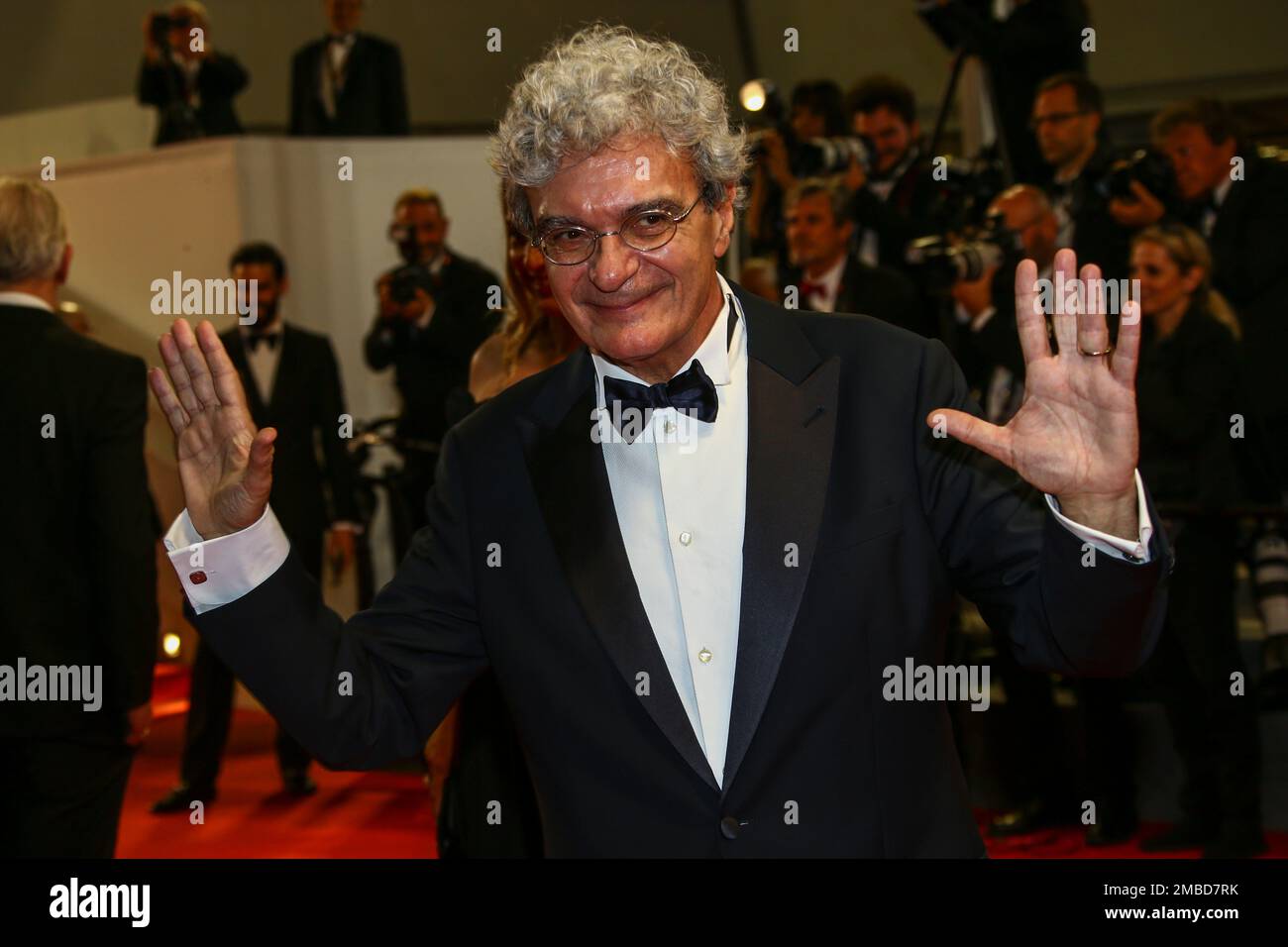 Director Mario Martone poses for photographers upon arrival at the ...